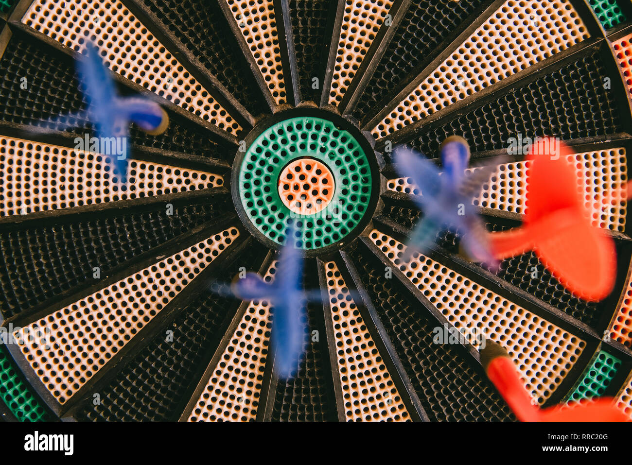 Center of a bullseye with colorful darts nailed, target concept Stock ...