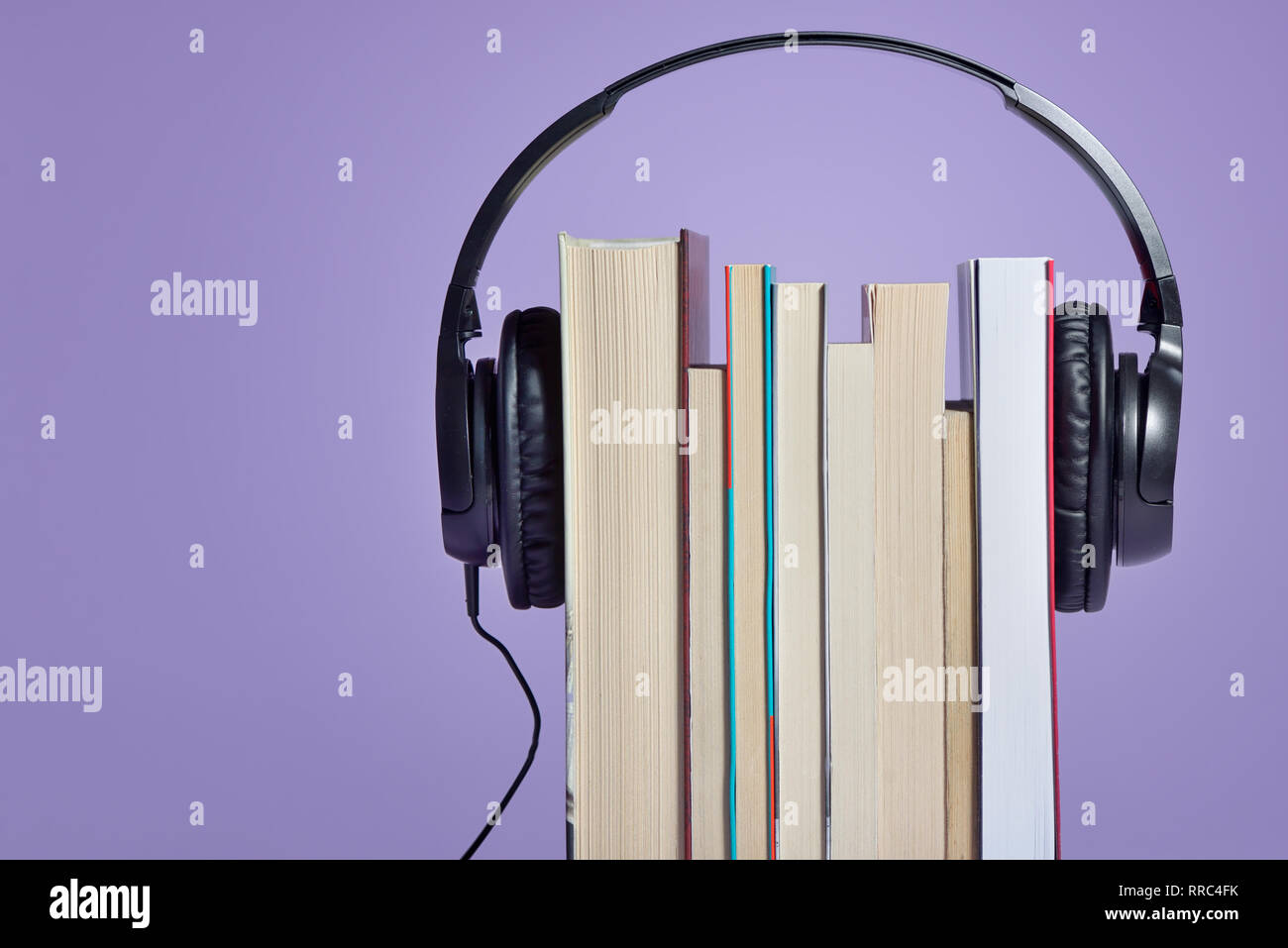 Audio books concept with books and headphones Stock Photo - Alamy