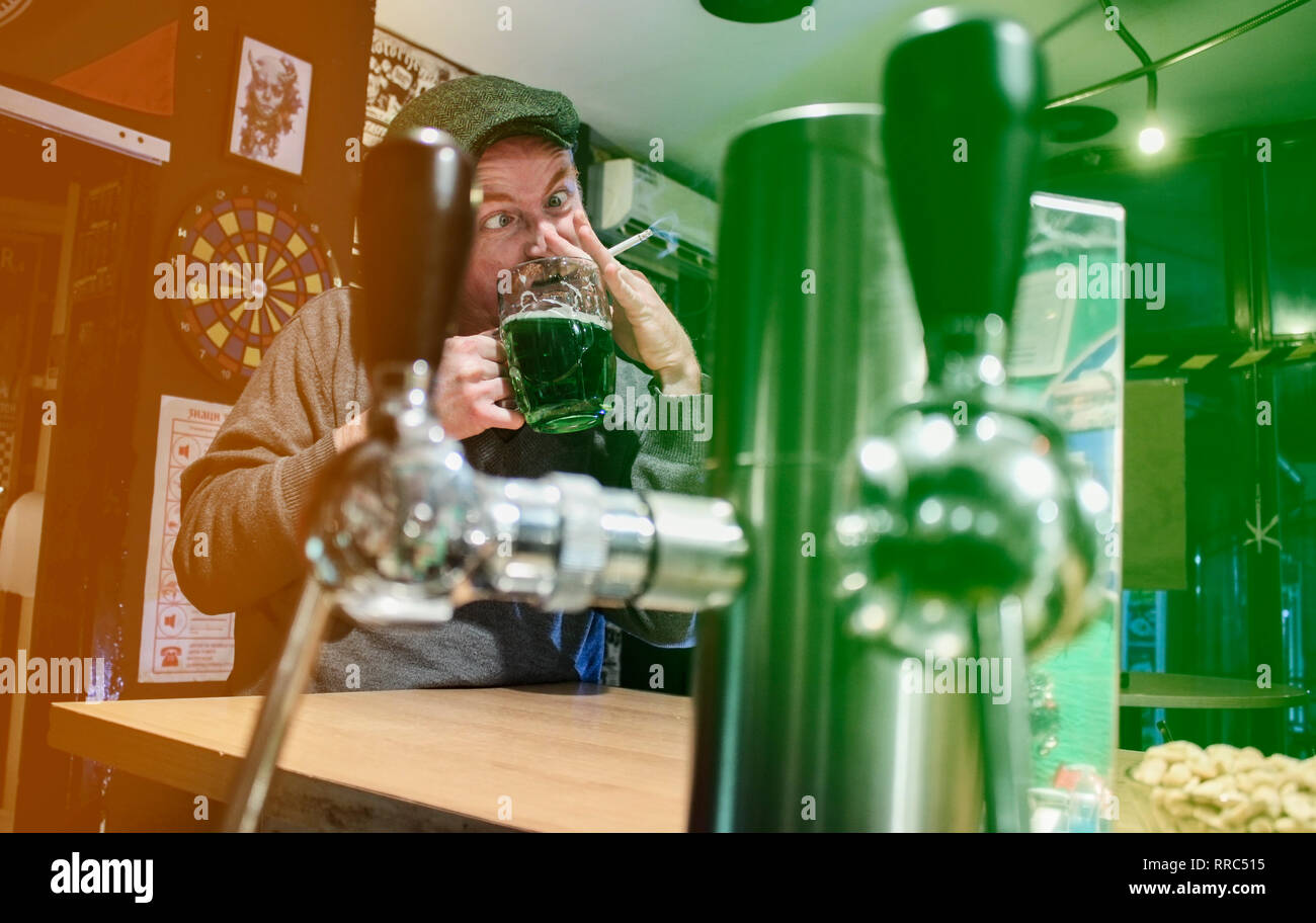 Irish man holding beer glass during the st patrick day hi-res stock ...
