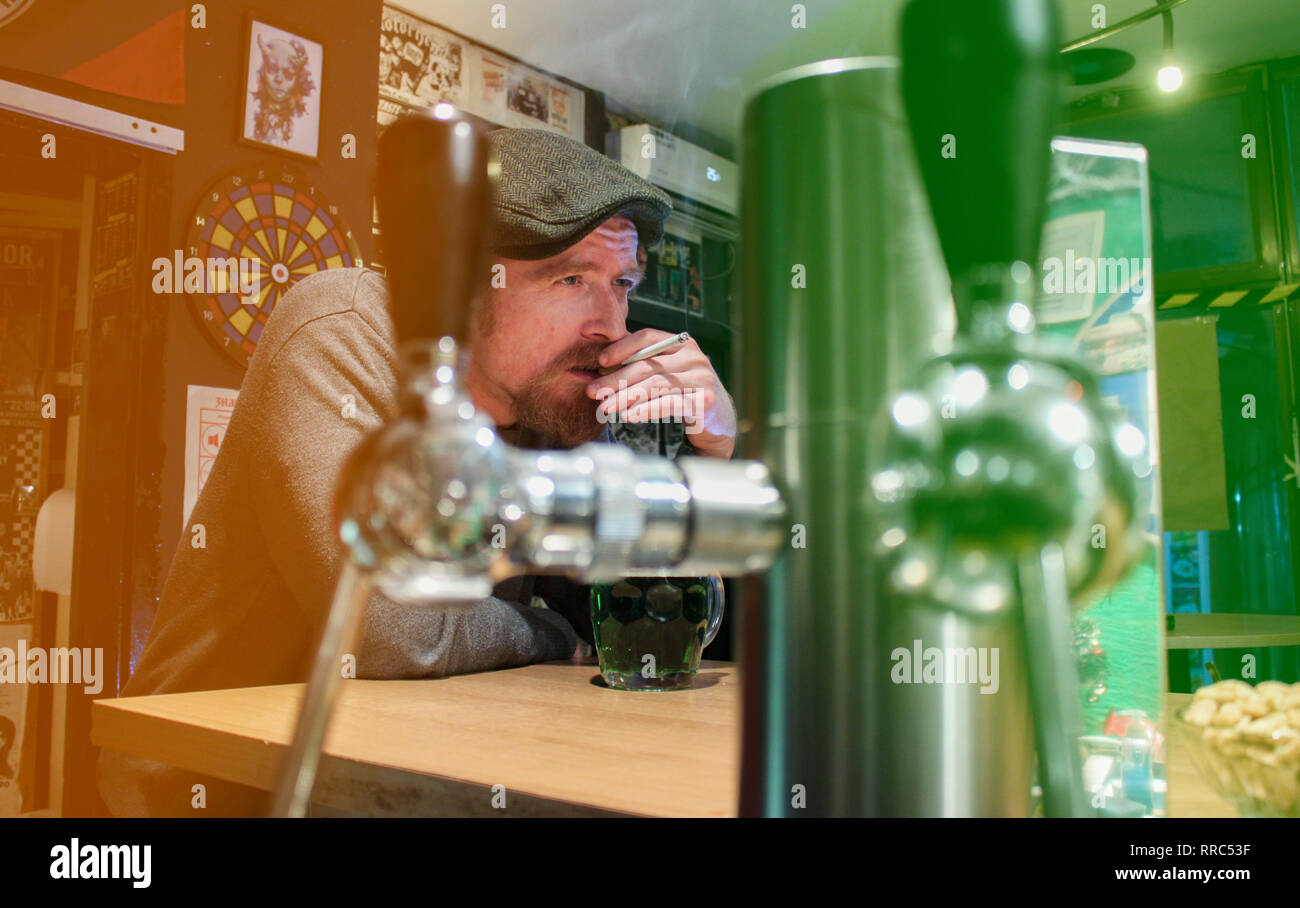 Diversity of faces and pub poses of drinking Irish guy during St ...