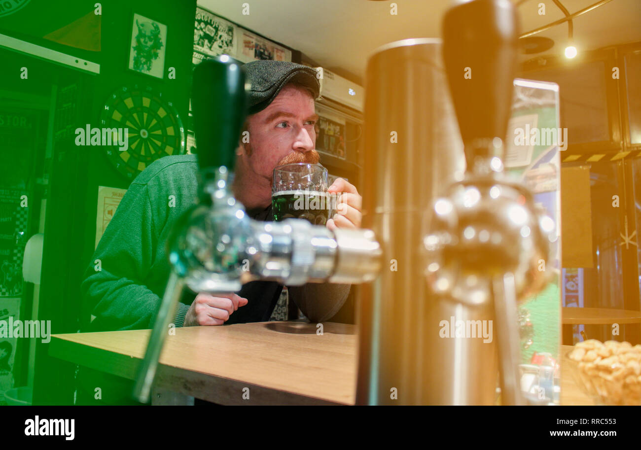 Diversity of faces and pub poses of drinking Irish guy during St ...