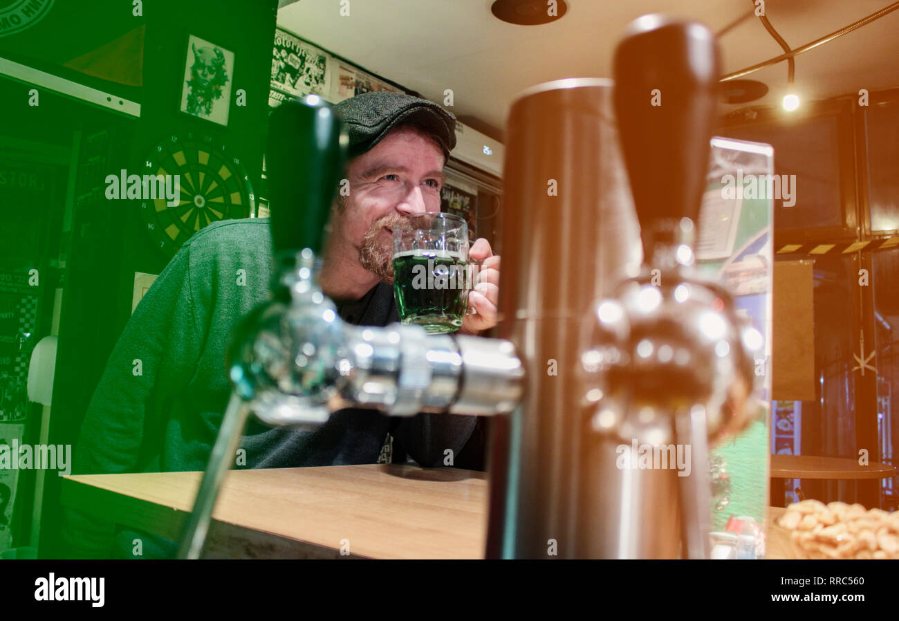 Diversity of faces and pub poses of drinking Irish guy during St ...