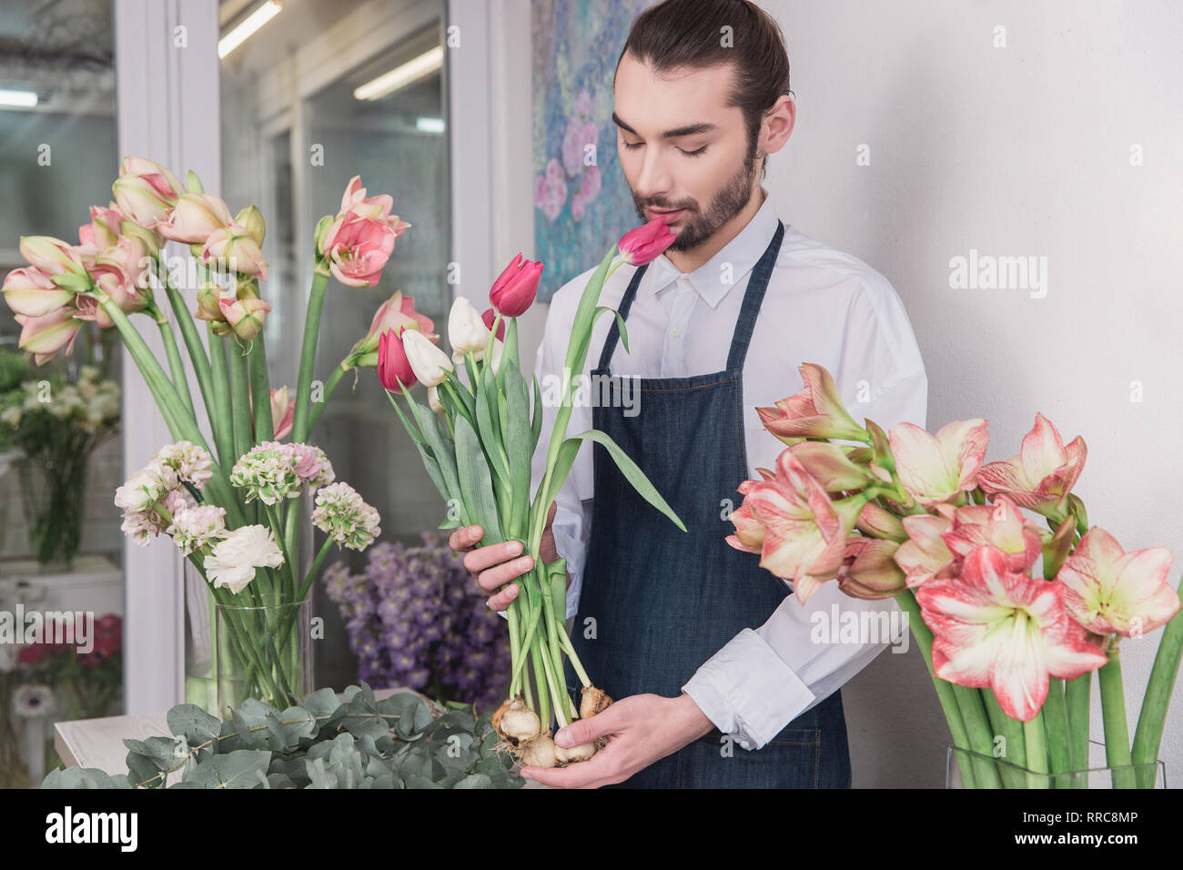 Small business. Male florist in flower shop. Floral design studio ...