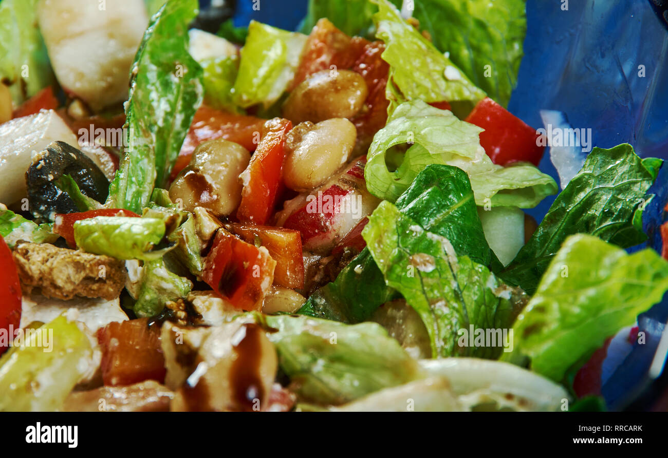 Summer French lettuce salad with feta cheese, olives, crackers, paprika ...