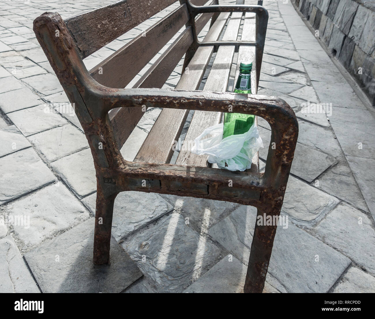 Empty beer bottle on park bench hi-res stock photography and images - Alamy