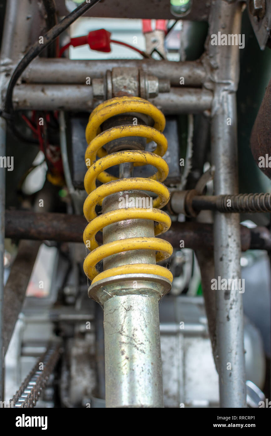 Used Coil Spring and Shock Absorber in a Quad. Maintance Concept Stock ...