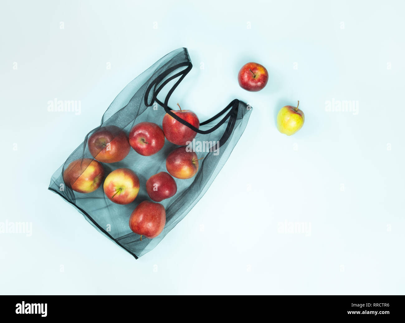Top view of apples in a reusable string bag. Sustainable eco packaging ...
