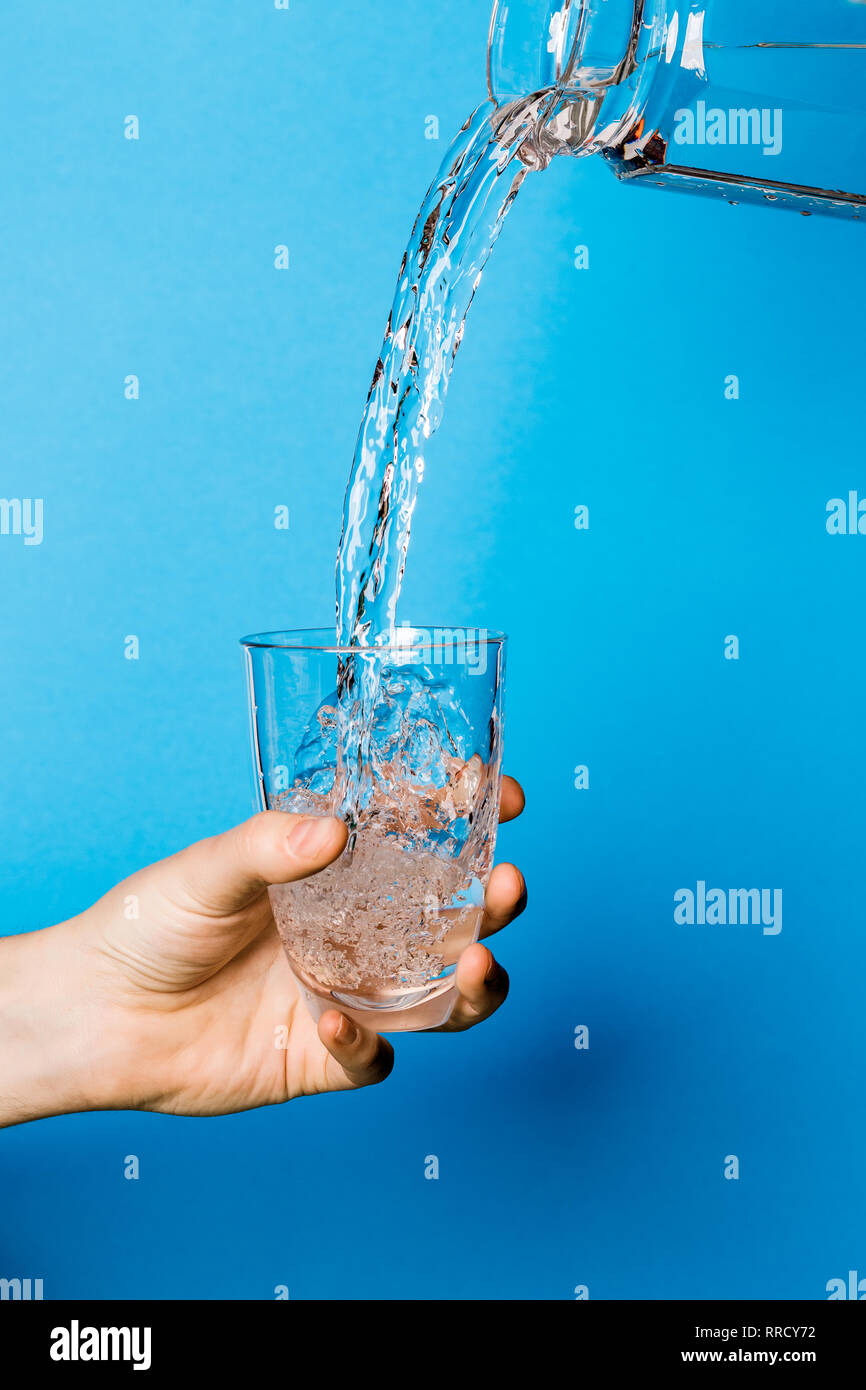 Photo of hand holding glass Stock Photo - Alamy