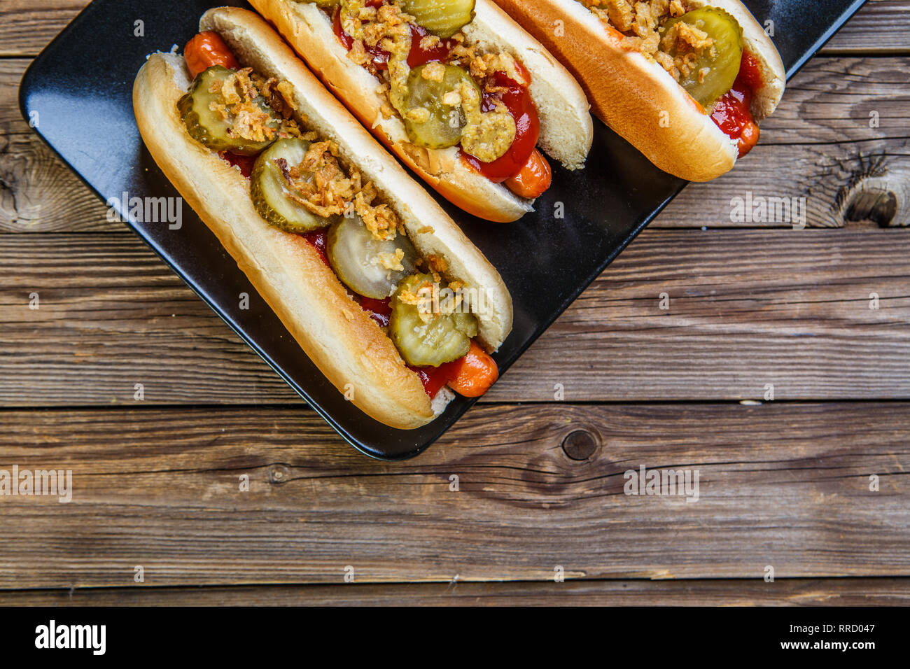 American hot dog with pickles,onions, ketchup and mustard Stock Photo ...