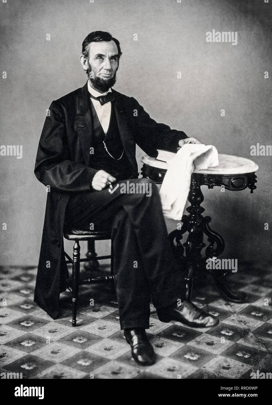 seated with right arm resting on ta 1863 Photo Abraham Lincoln Sunday ...