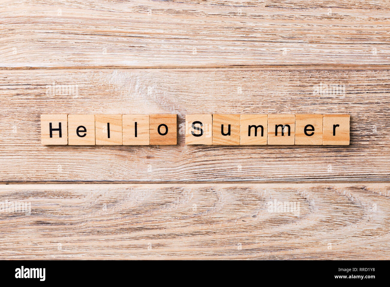 Hello Summer word written on wood block. Hello Summer text on wooden ...
