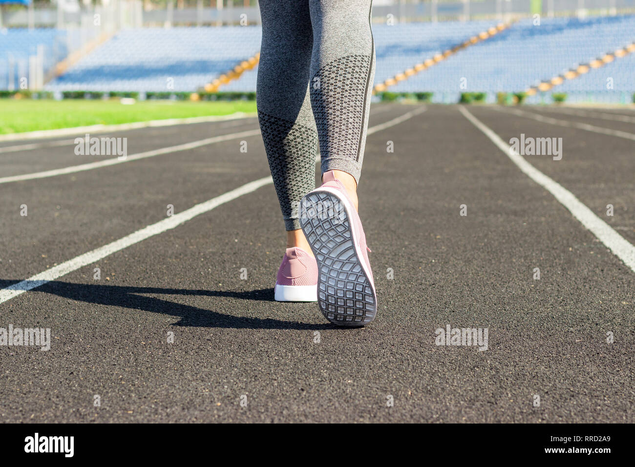 Ready to go. Close up photo of shoe of female athlete on the starting ...