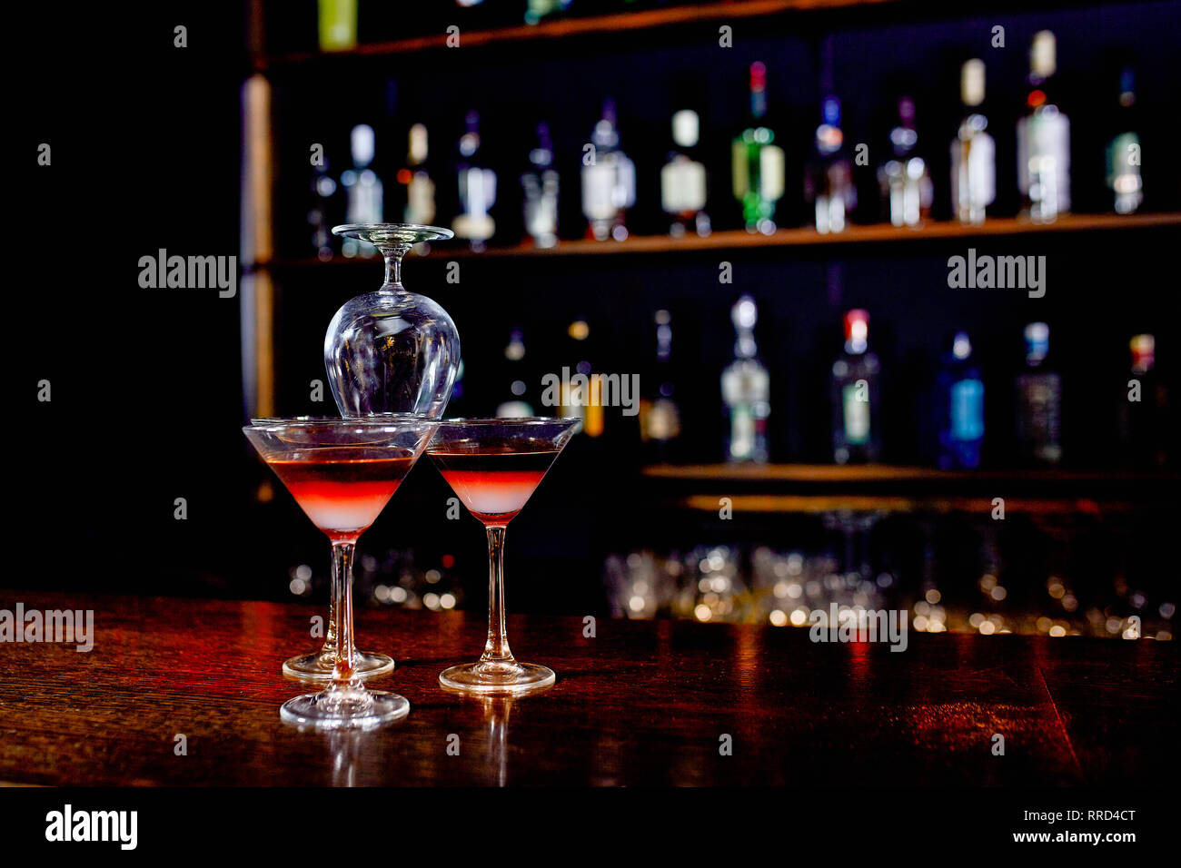 The pyramid of cocktails on the bar on a blurred background of the ...