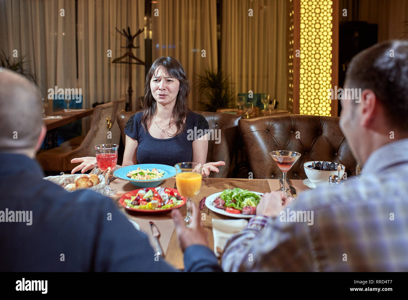 Discussion of three angry friends arguing in a coffee shop Stock Photo ...