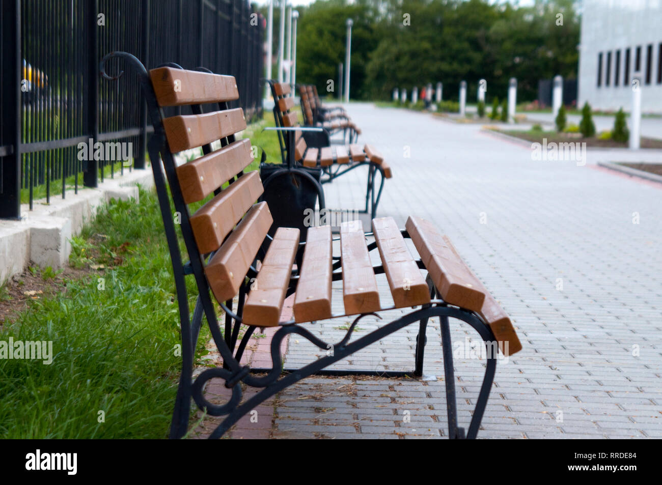 High resolution image. Bench in city street. City sidewalk Stock Photo ...