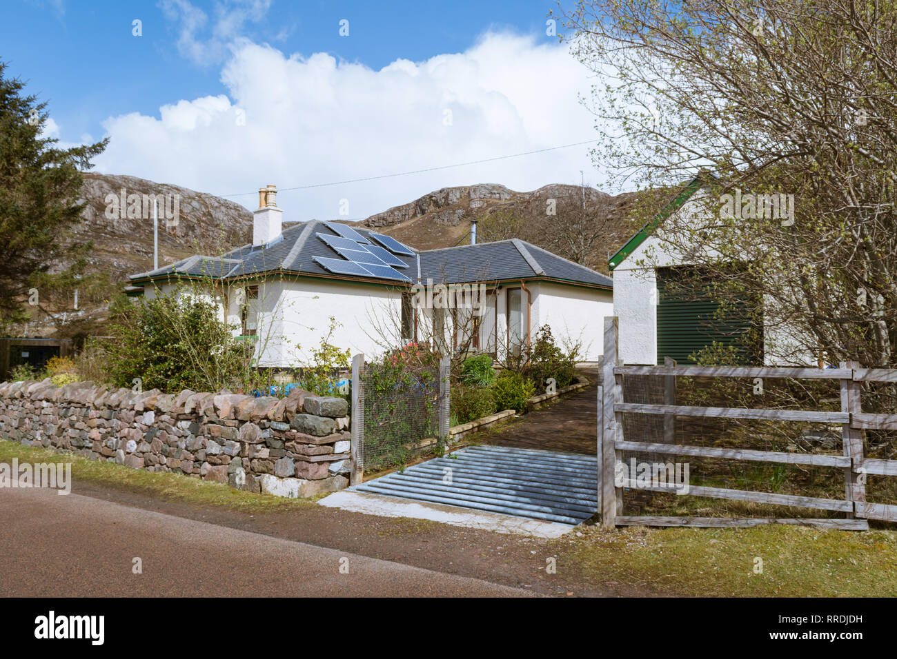 Cattle grid across residential driveway, Shieldaig, Scottish Highlands ...
