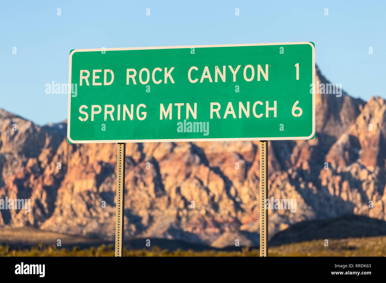 Early morning view of route 159 highway sign and desert mountains near ...