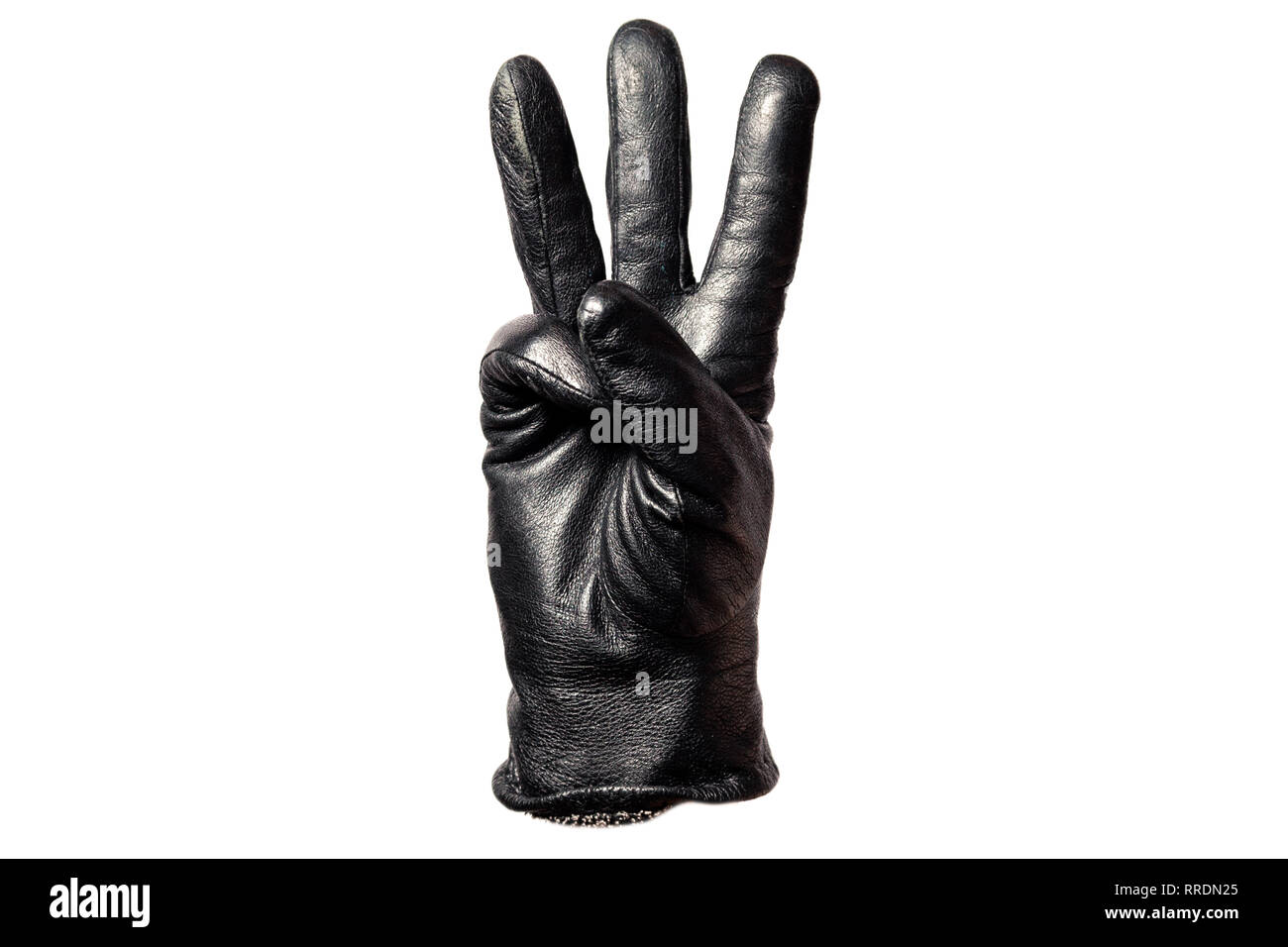 Close-up black leather glove, fingers showing number three. Isolated on ...