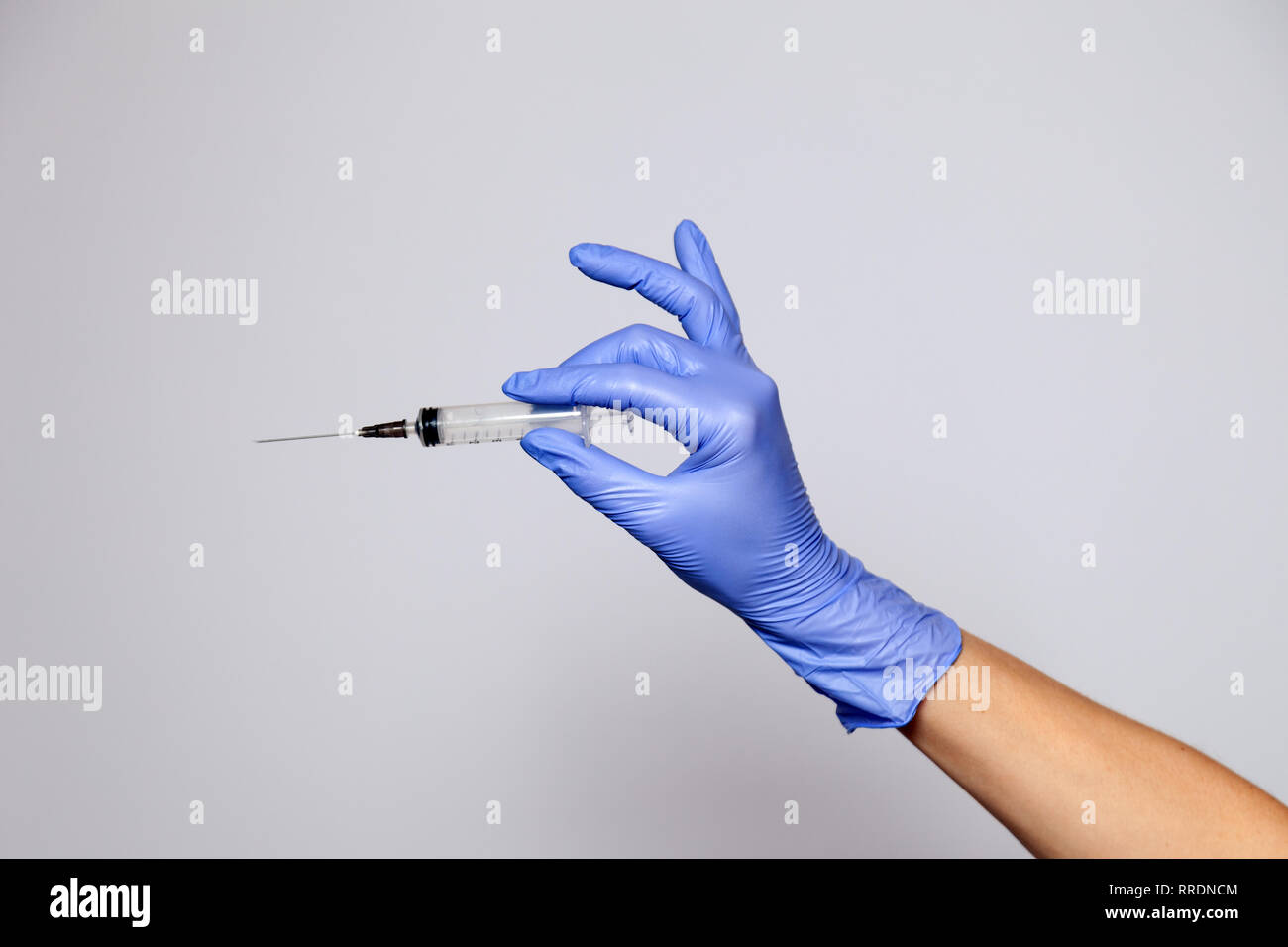 Closeup doctor hand in rubber latex medical purple glove hold ...