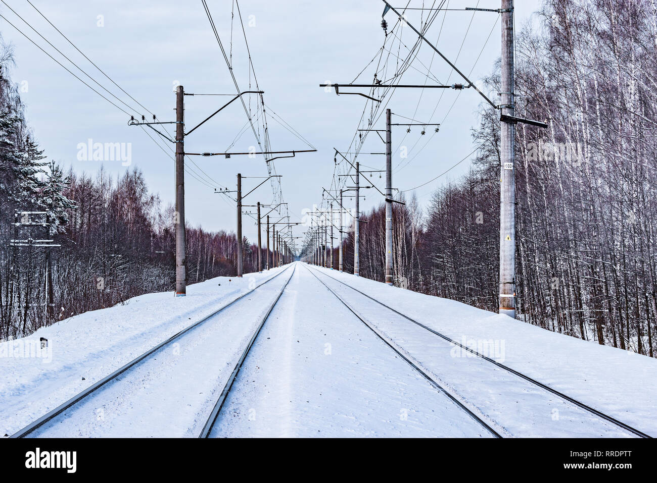 Electric railway lines at winter day time Stock Photo - Alamy