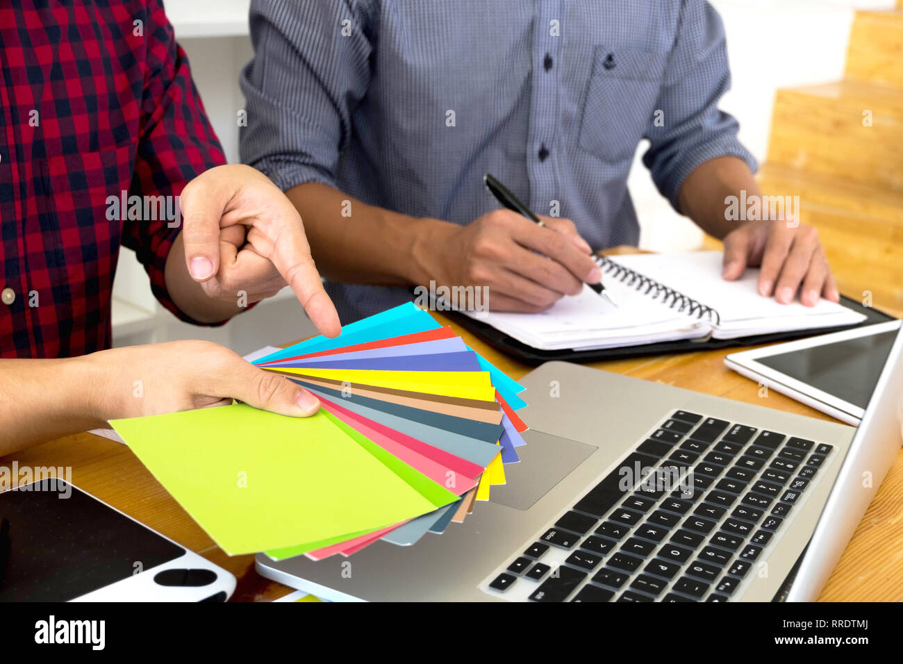 Graphic designers choose colors from the color bands samples for design ...