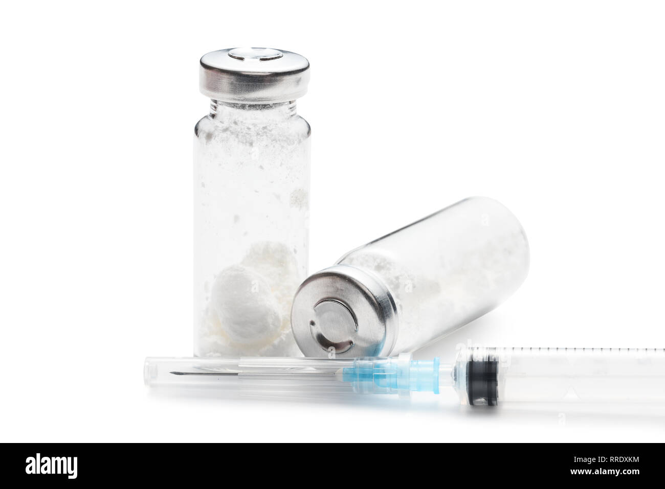 Injection bottles with white powder and syringe Stock Photo - Alamy
