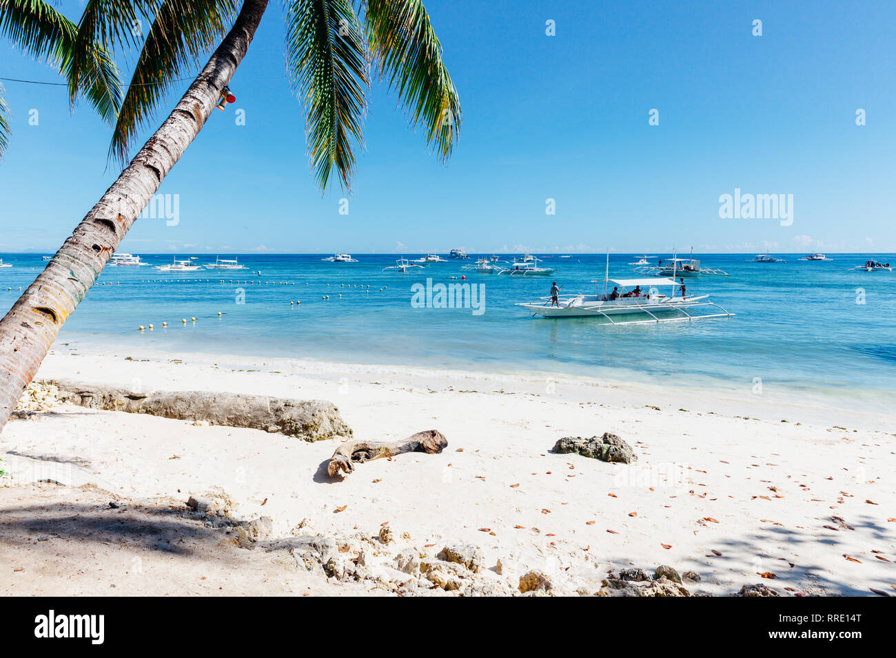 An idyllic view of the popular white sand Alona Beach located on ...