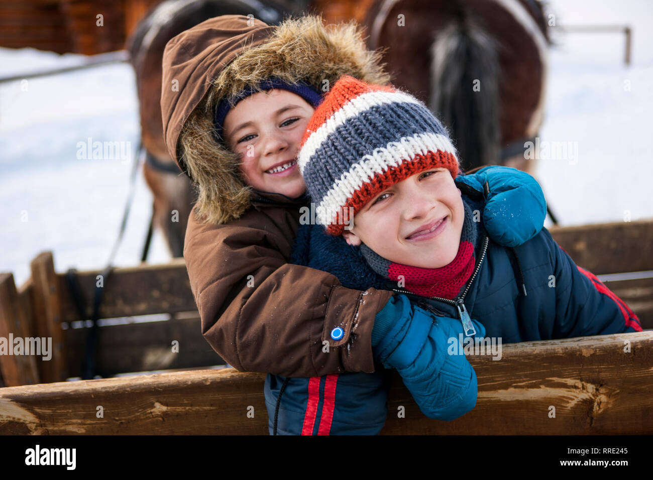 Portrait of two smiling brothers dressed in warm clothing Stock Photo ...
