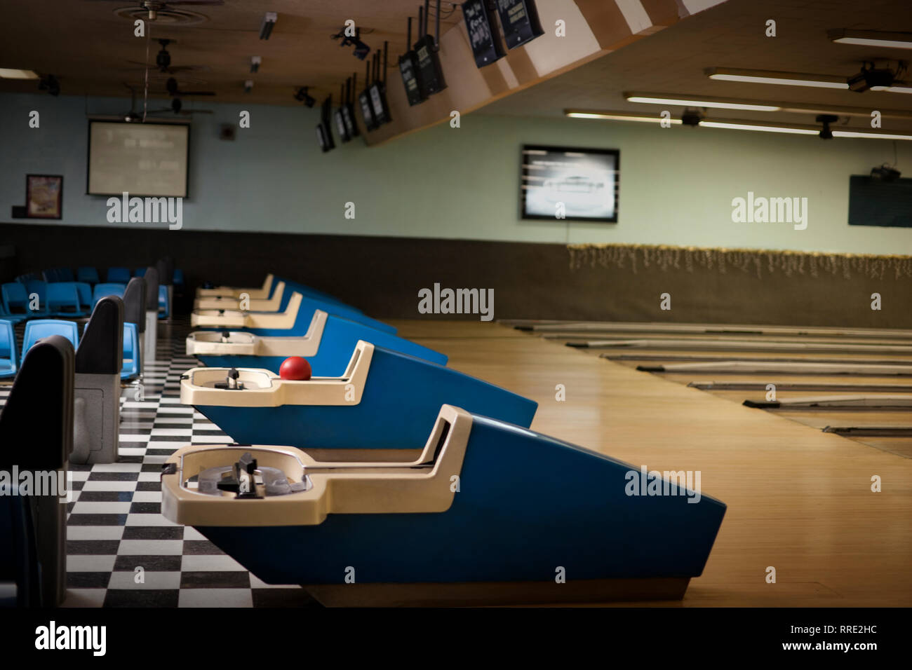 Seating area in an empty bowling alley Stock Photo - Alamy