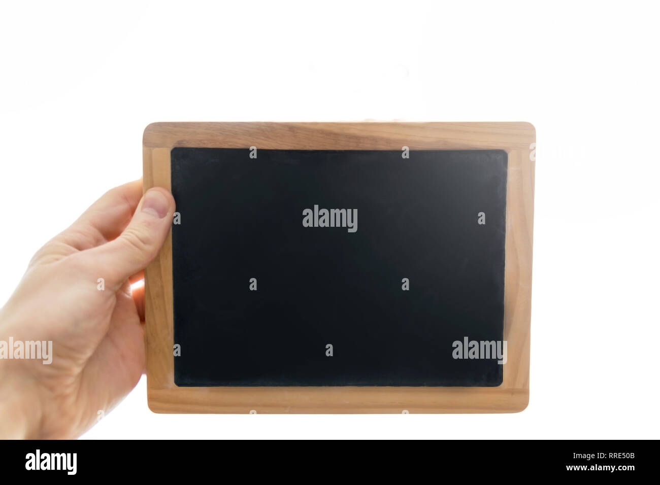 Man hand holding a small blackboard or chalkboard against white ...