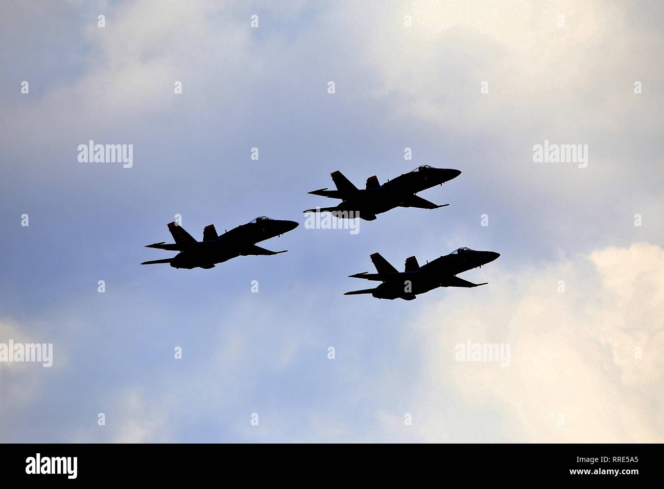 Silhouette of fighter jets in formation Stock Photo - Alamy