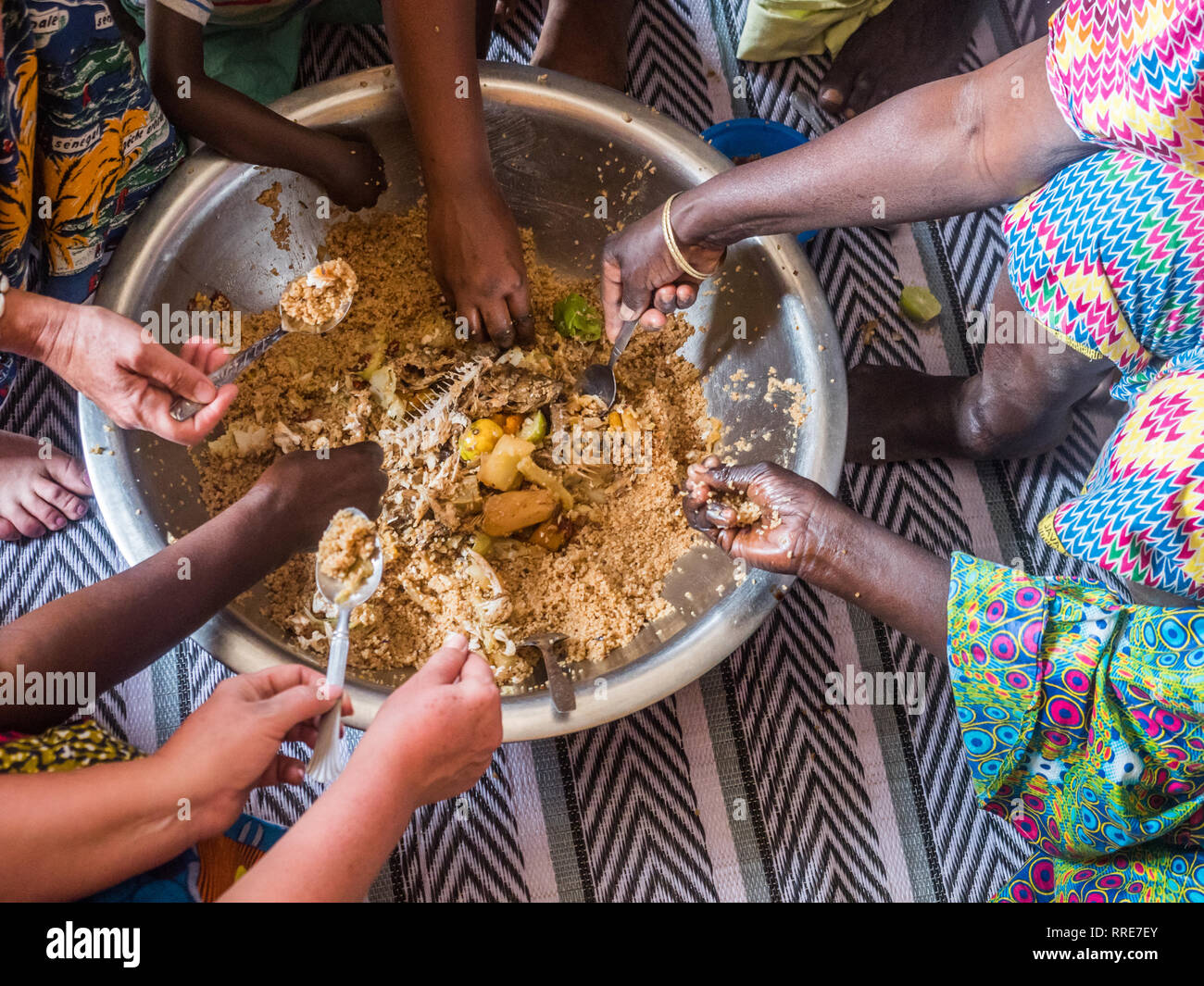 Senegal family eating together in the traditional manner. Senegal ...