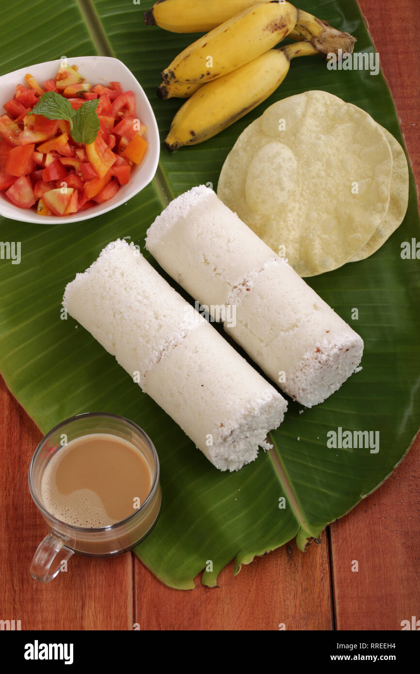 Top view of white puttu on a banana leaf Stock Photo - Alamy