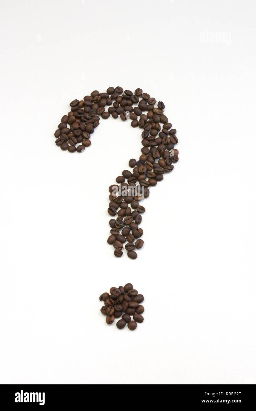 Question mark of coffee beans close up isolated on white . copy space ...