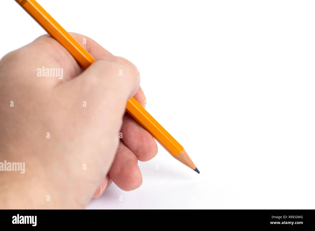 Hand with pencil close-up view. Over white blank empty paper. Imitation ...