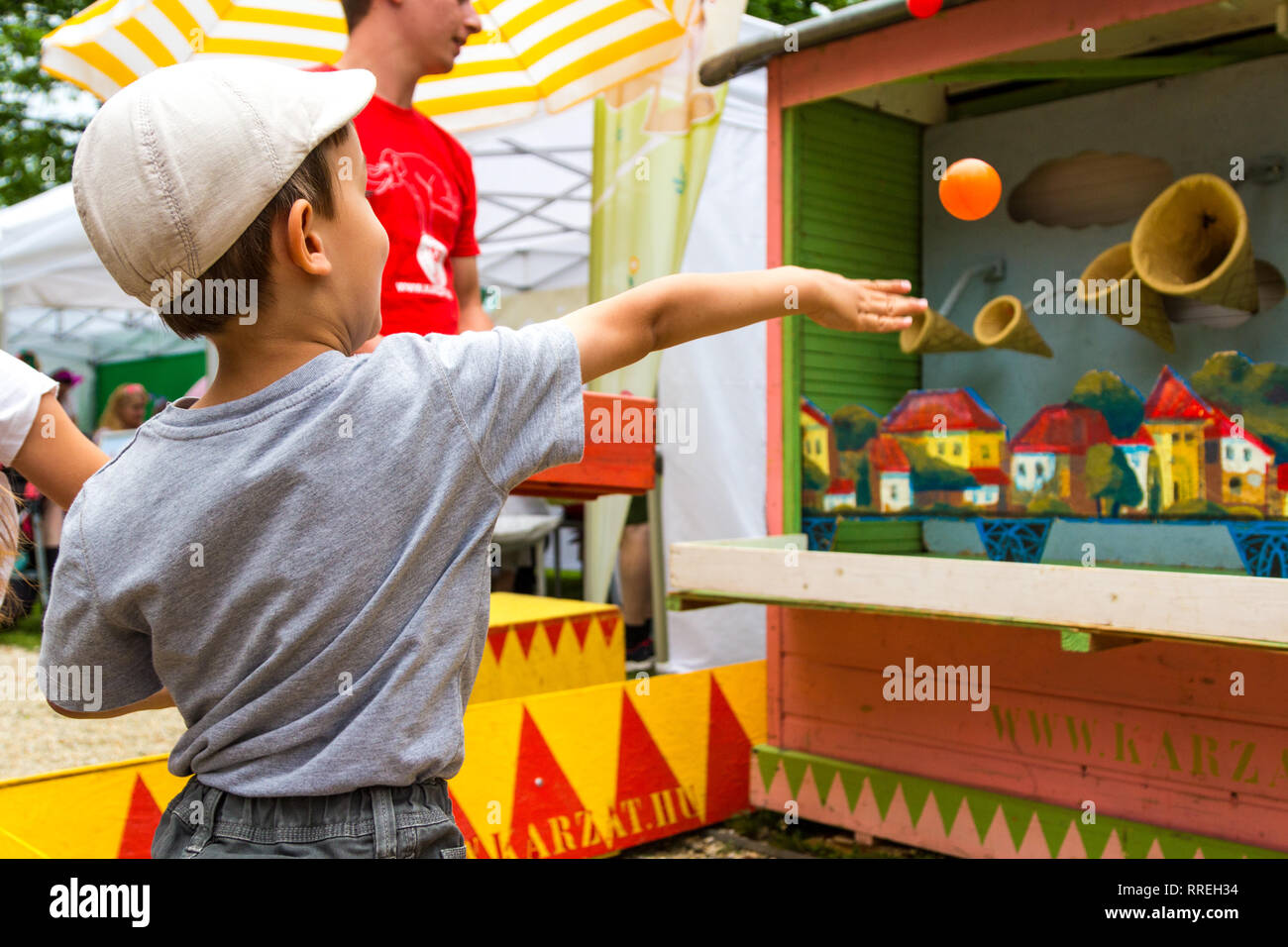 Children throwing ball hi-res stock photography and images - Alamy