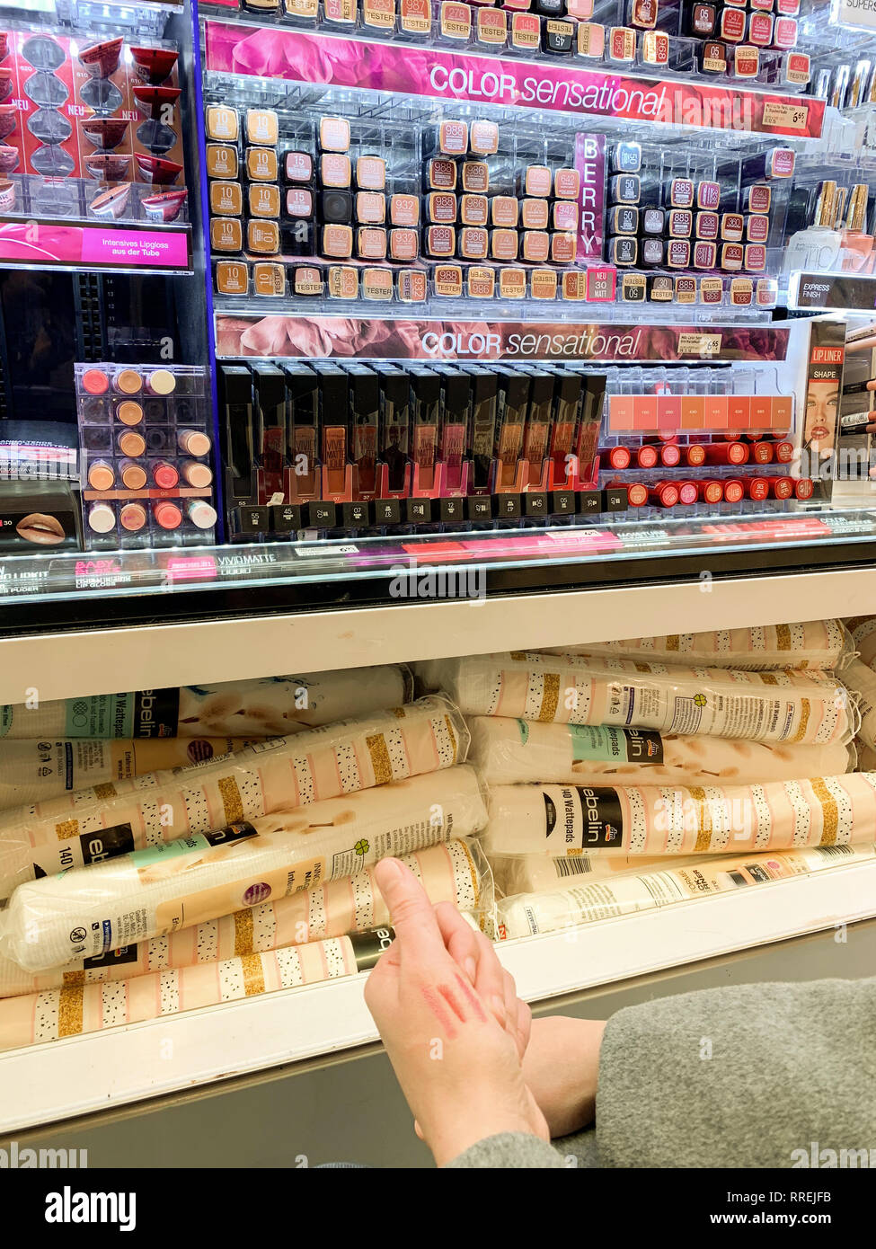 MUNICH, GERMANY - OCT 27, 2018: Fashionable woman buying in cosmetics ...