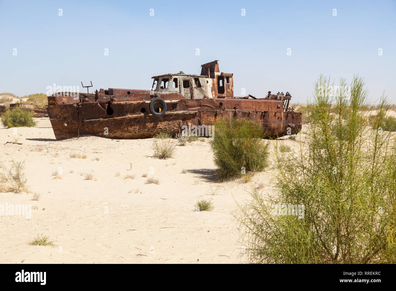 Rustic boats on a ship graveyards on a desert around Moynaq, Moynoq or ...