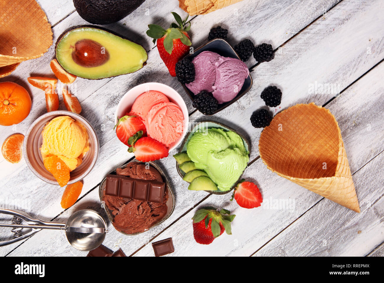 Set of ice cream scoops of different colors and flavours with berries ...