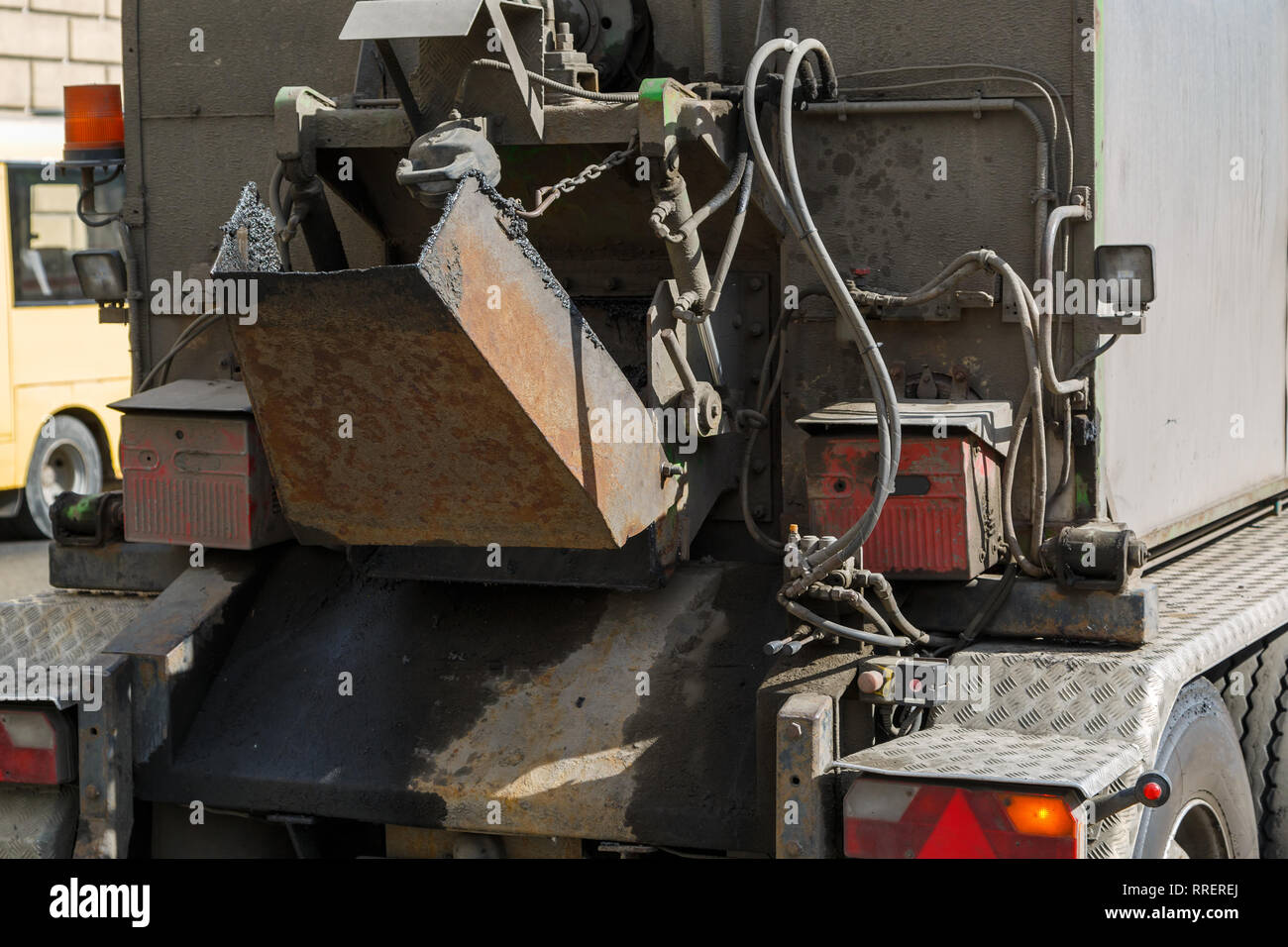 Machine for transporting and unloading hot asphalt Stock Photo - Alamy