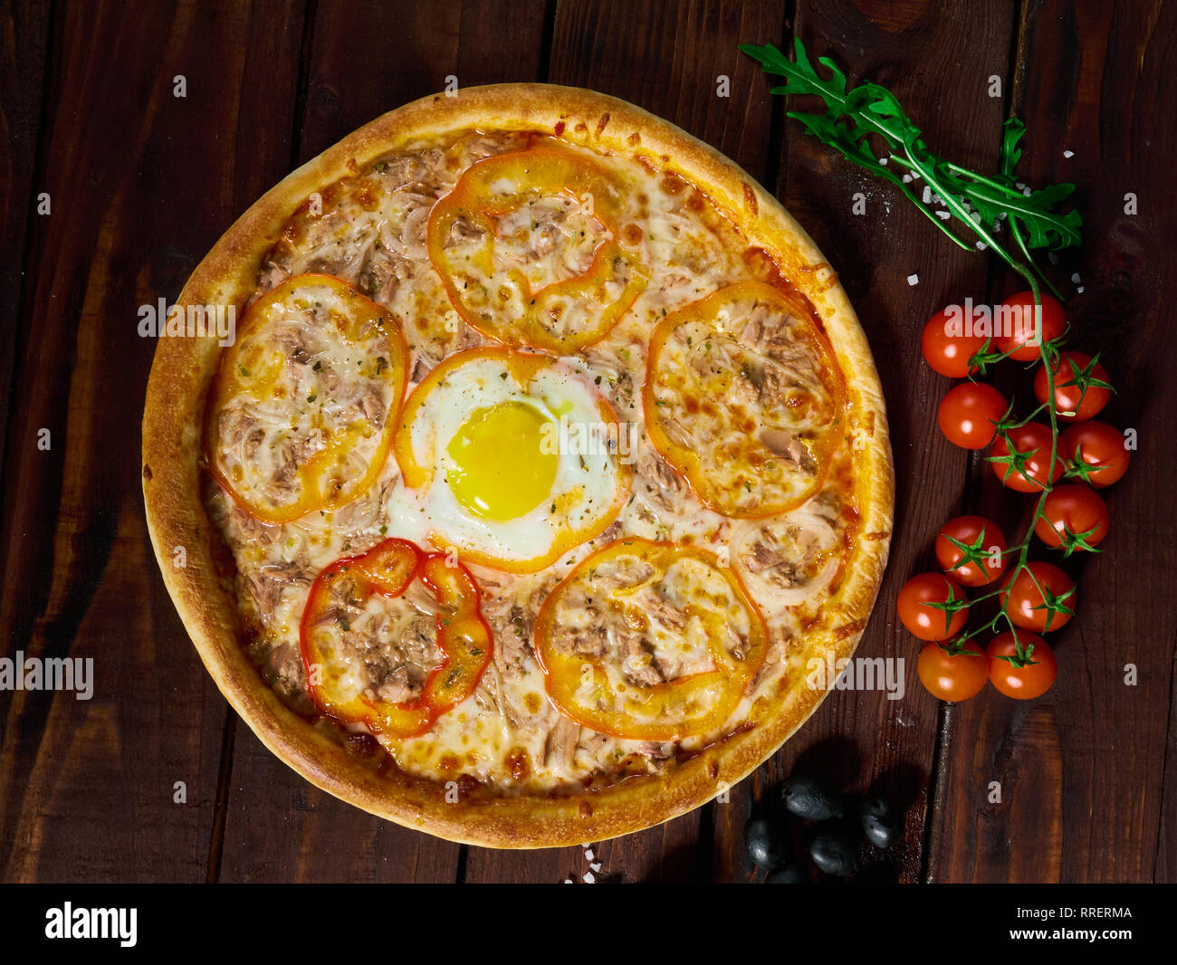delicious Italian pizza with egg top view close-up Stock Photo - Alamy