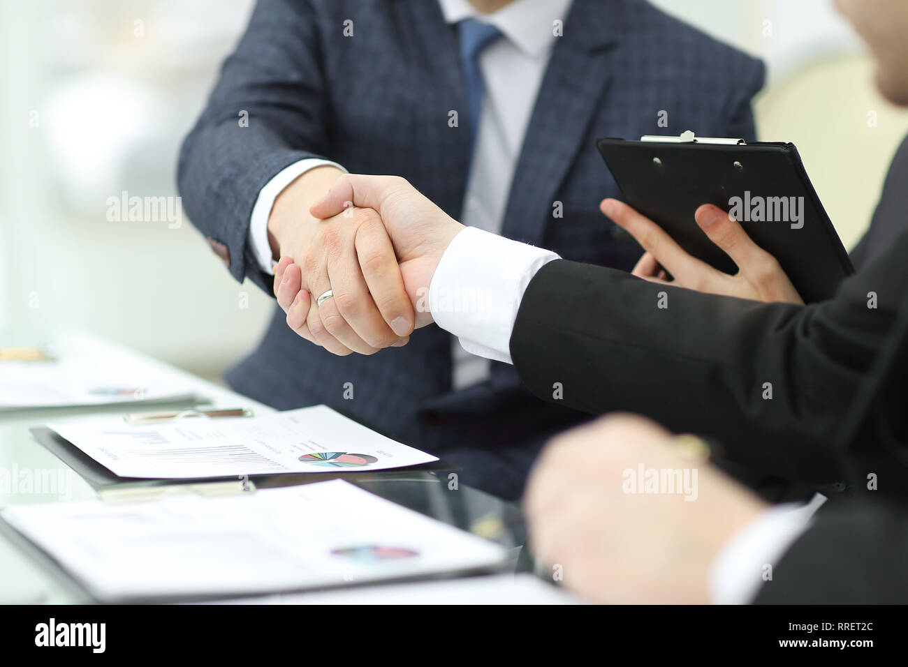 Business handshake financial partners hi-res stock photography and ...