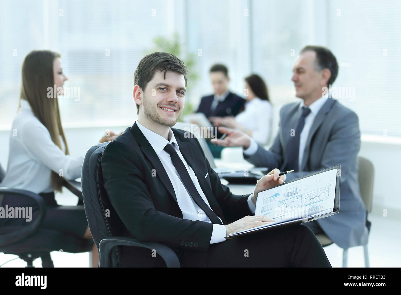 business man at office with his business team working behind Stock ...