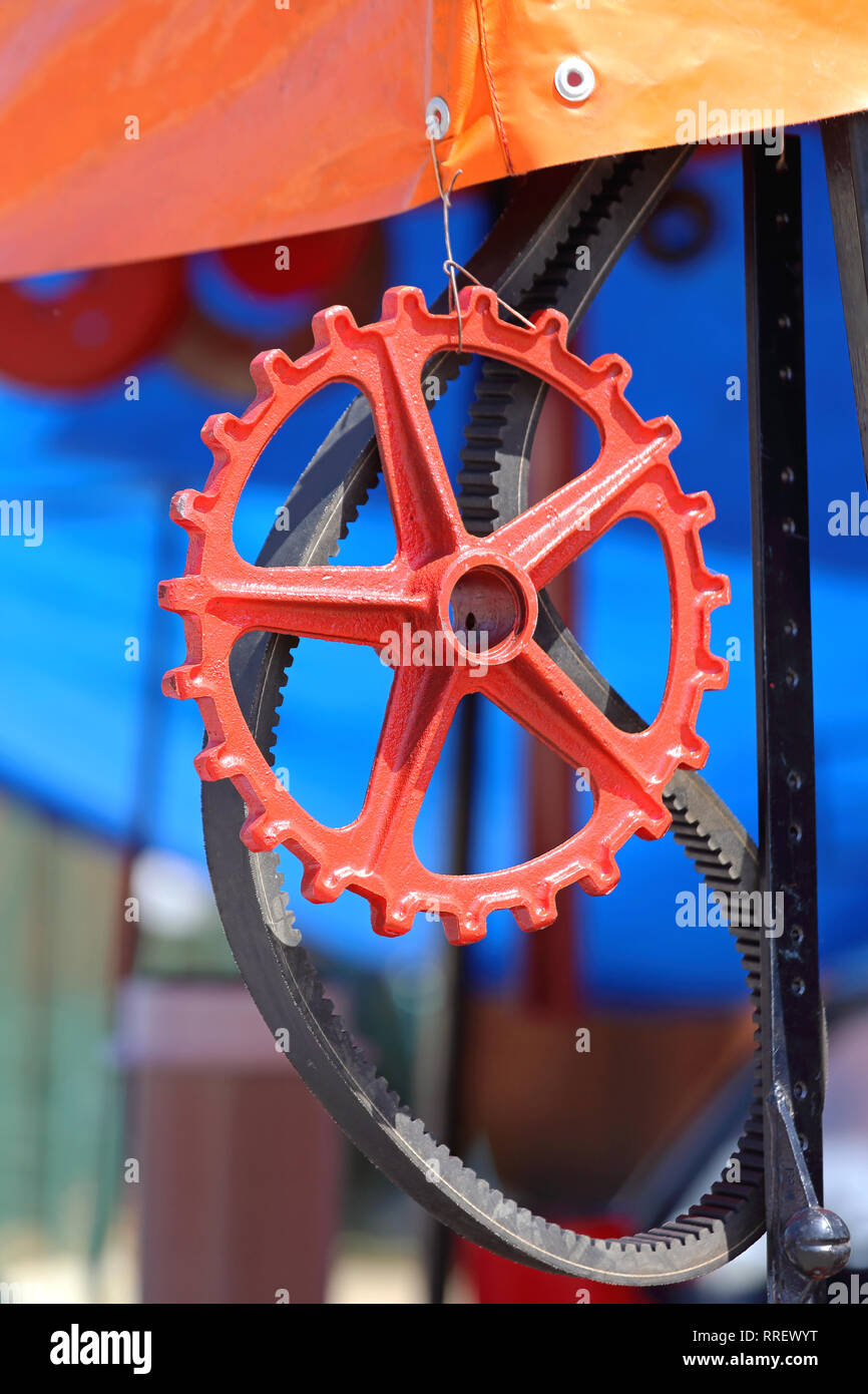One Red Cog Wheel Gear Spare Part Stock Photo - Alamy