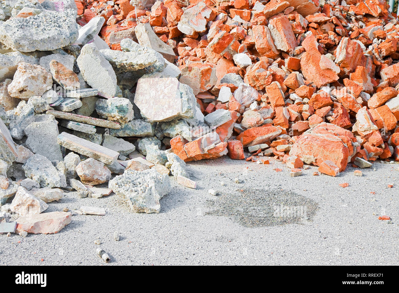 Concrete and brick rubble debris on construction site after a ...