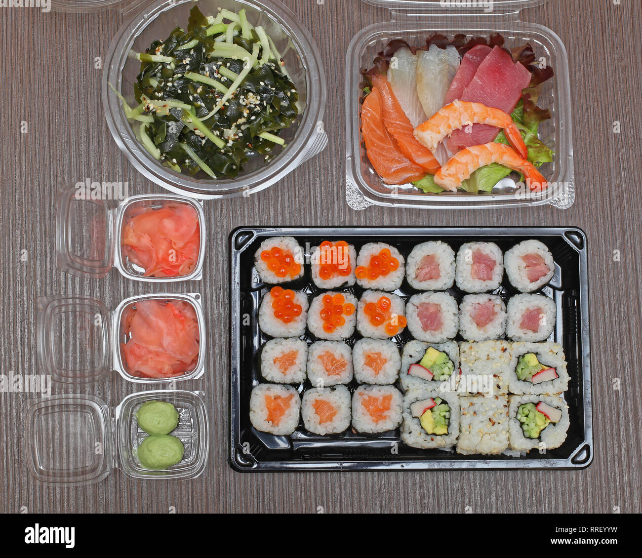 Raw Fish Slices Japanese Sashimi and Sushi Algae Salad Stock Photo - Alamy
