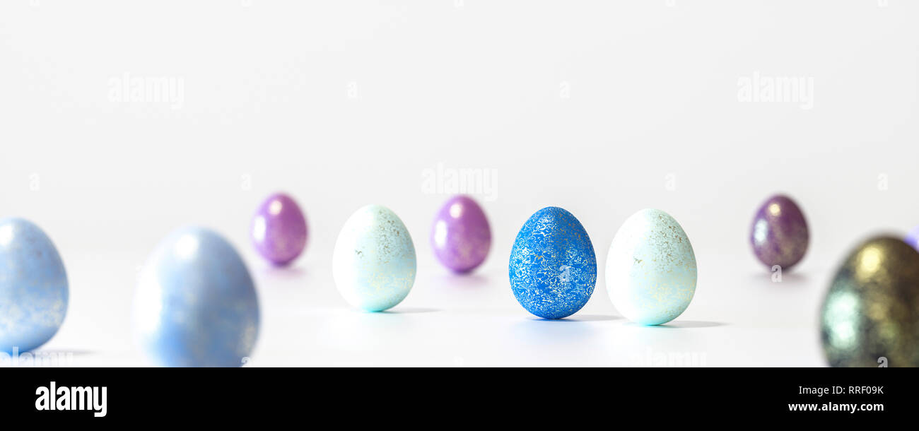 Blue, Red, green, cyan and pink colored Easter eggs balanced on its ...