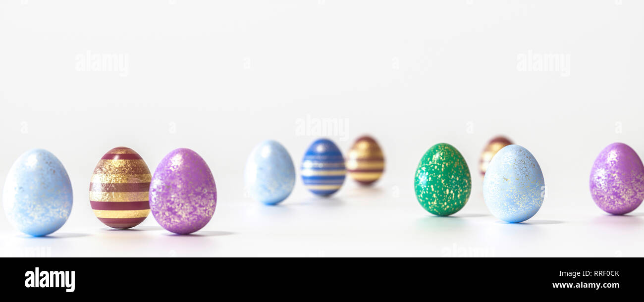 Blue, Red, green, cyan and pink colored Easter eggs balanced on its ...