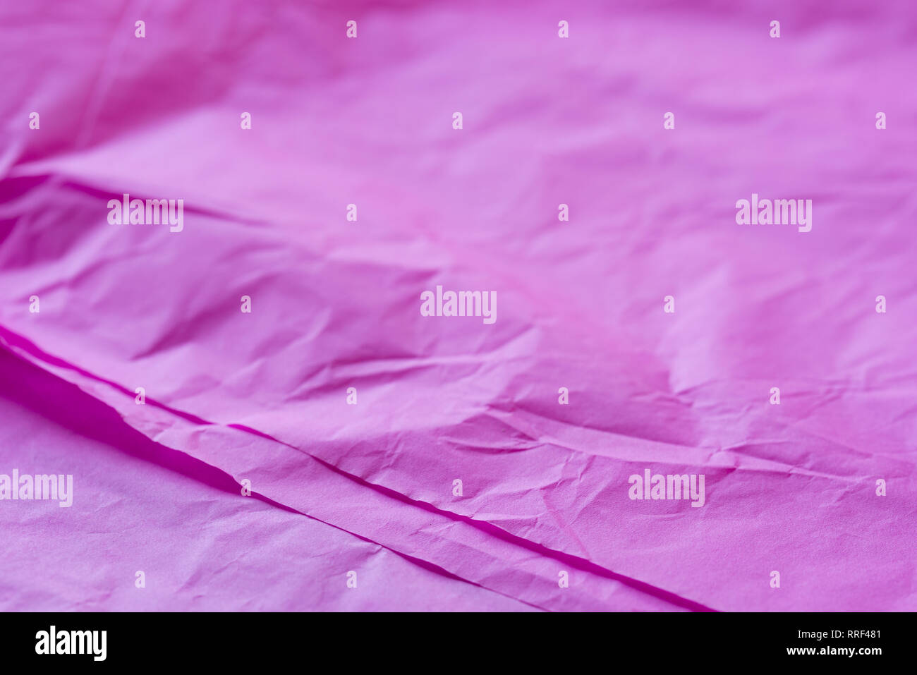 pink color creased paper tissue background texture Stock Photo - Alamy