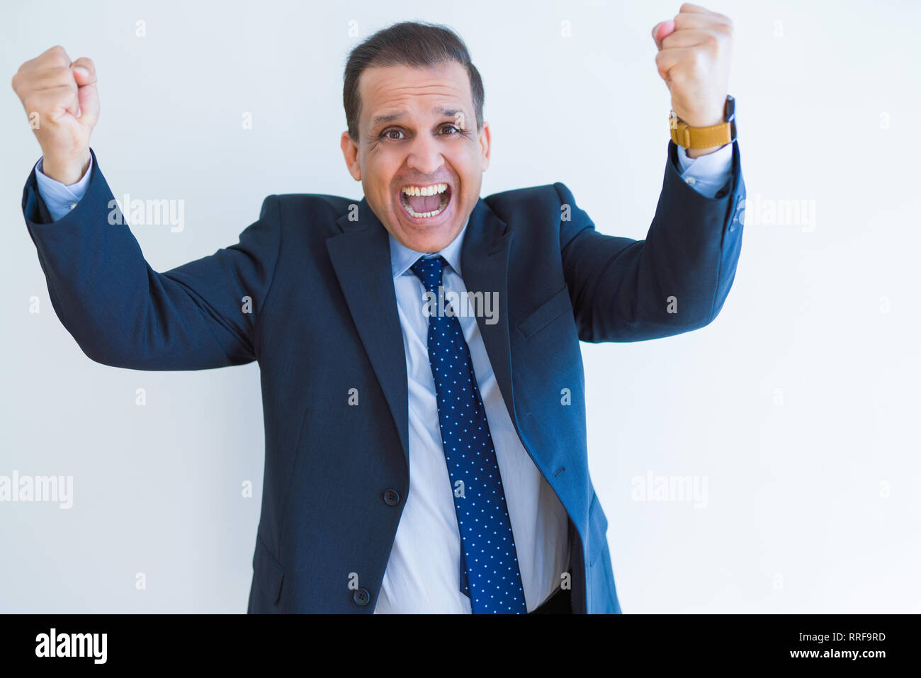 Middle age business man celebrating and screaming happy for succesful ...